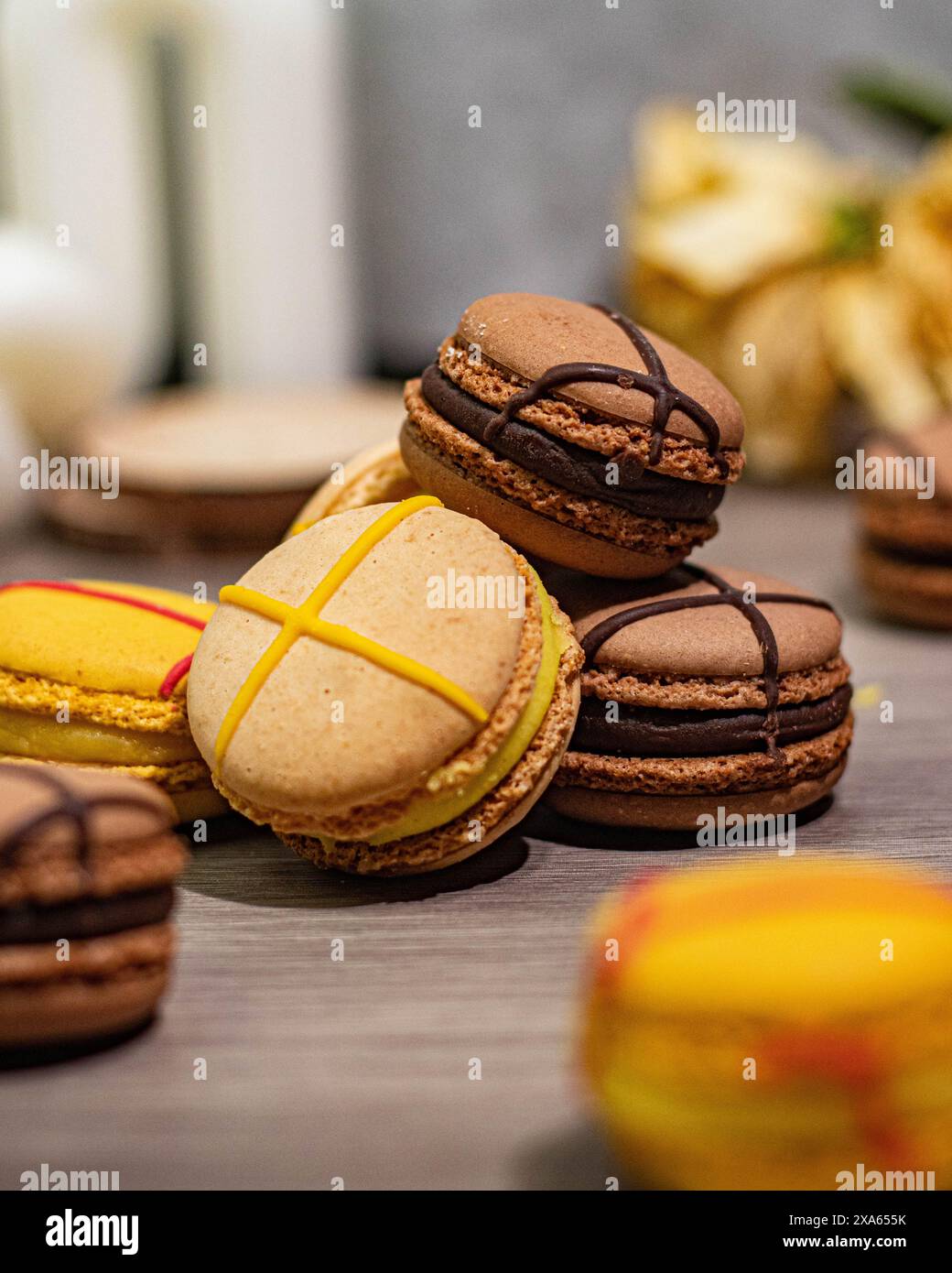 The Colorful macarons and assorted sweets displayed on a table Stock ...