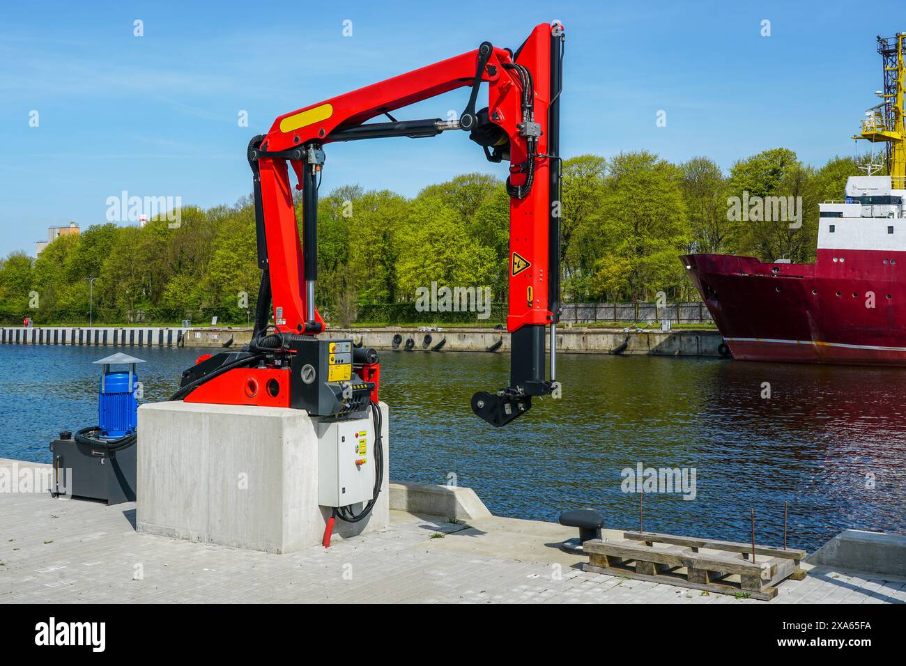 Port infrastructure element, a small hydraulic articulating crane on a ...