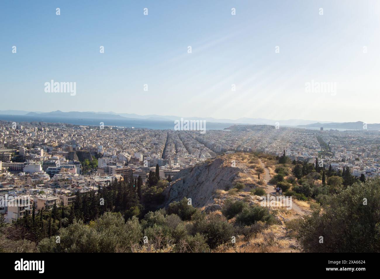 A scenic view of Athens, Greece with ancient ruins against a backdrop ...