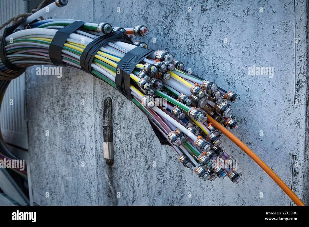 A close-up of multiple wires connected to a wall Stock Photo - Alamy