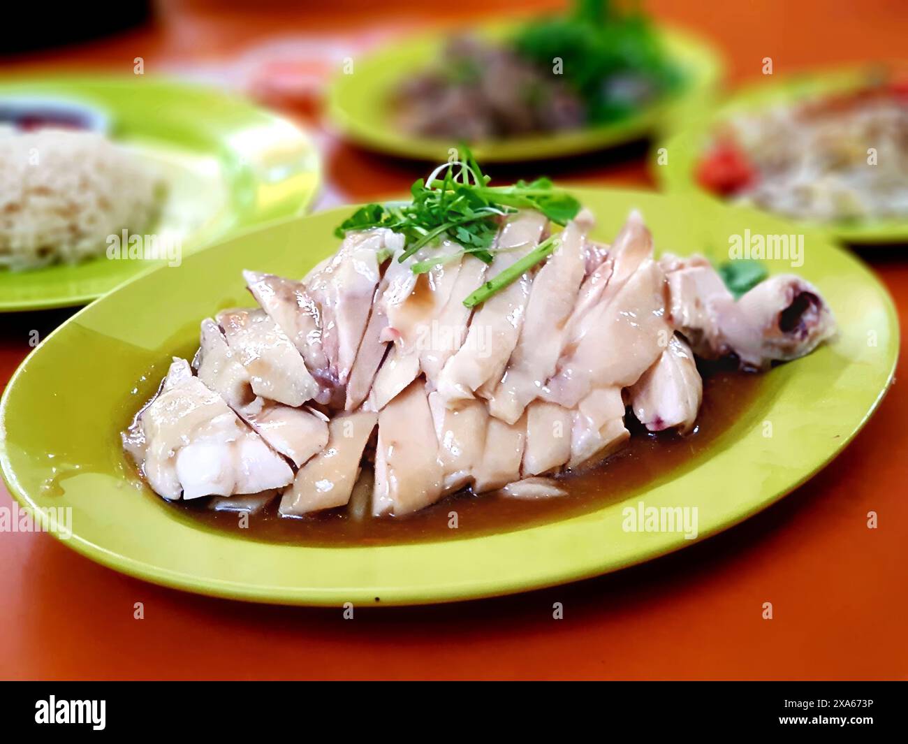 A traditional Singaporean Chicken Rice served with tender chicken Stock ...
