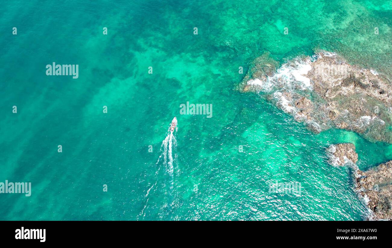 Aerial view of clear waters and rocky terrain below Stock Photo - Alamy