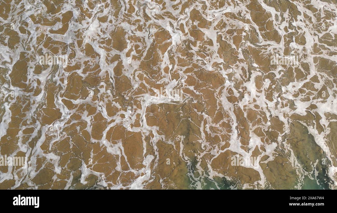 Aerial view of clear waters and rocky terrain below Stock Photo - Alamy