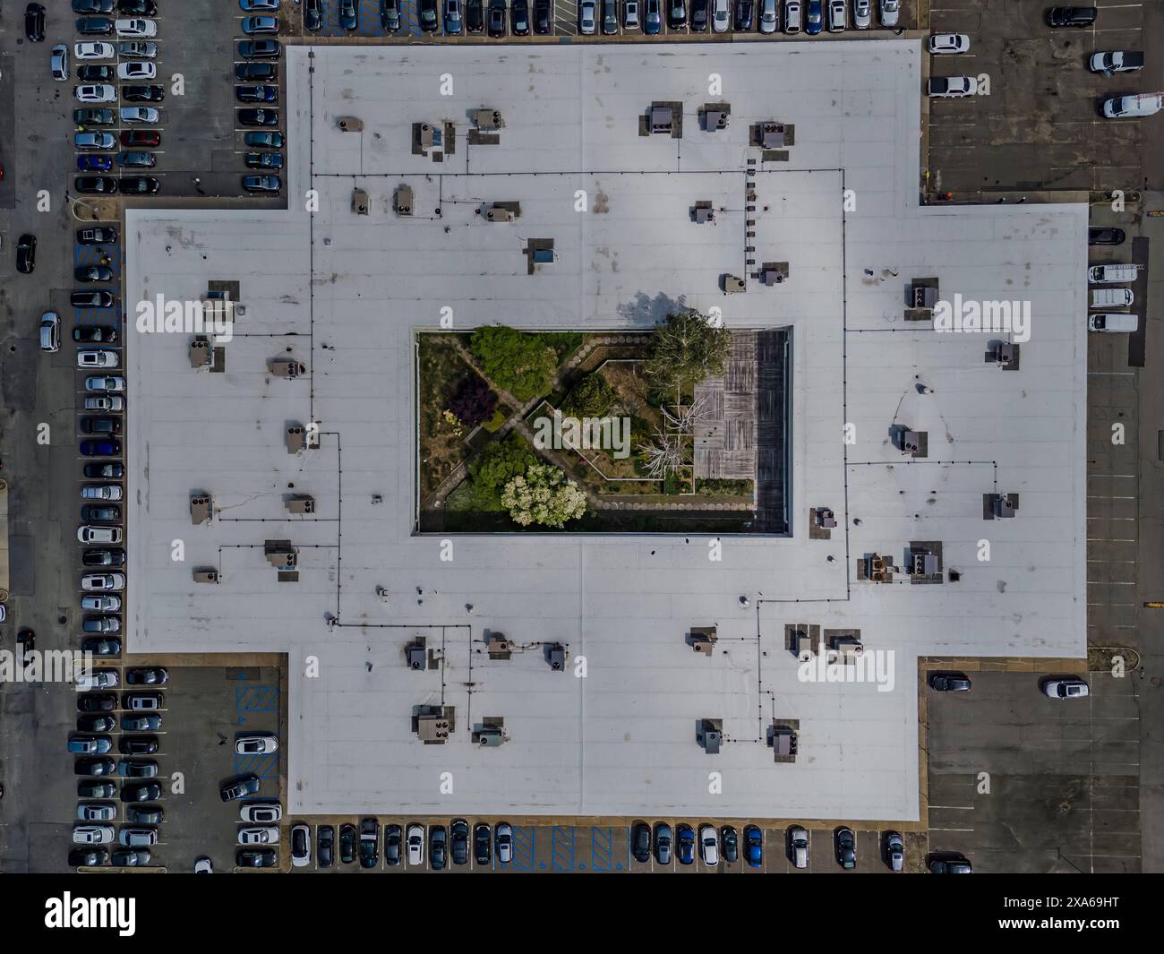 Aerial view of a spacious office building with rooftop air conditioning ...