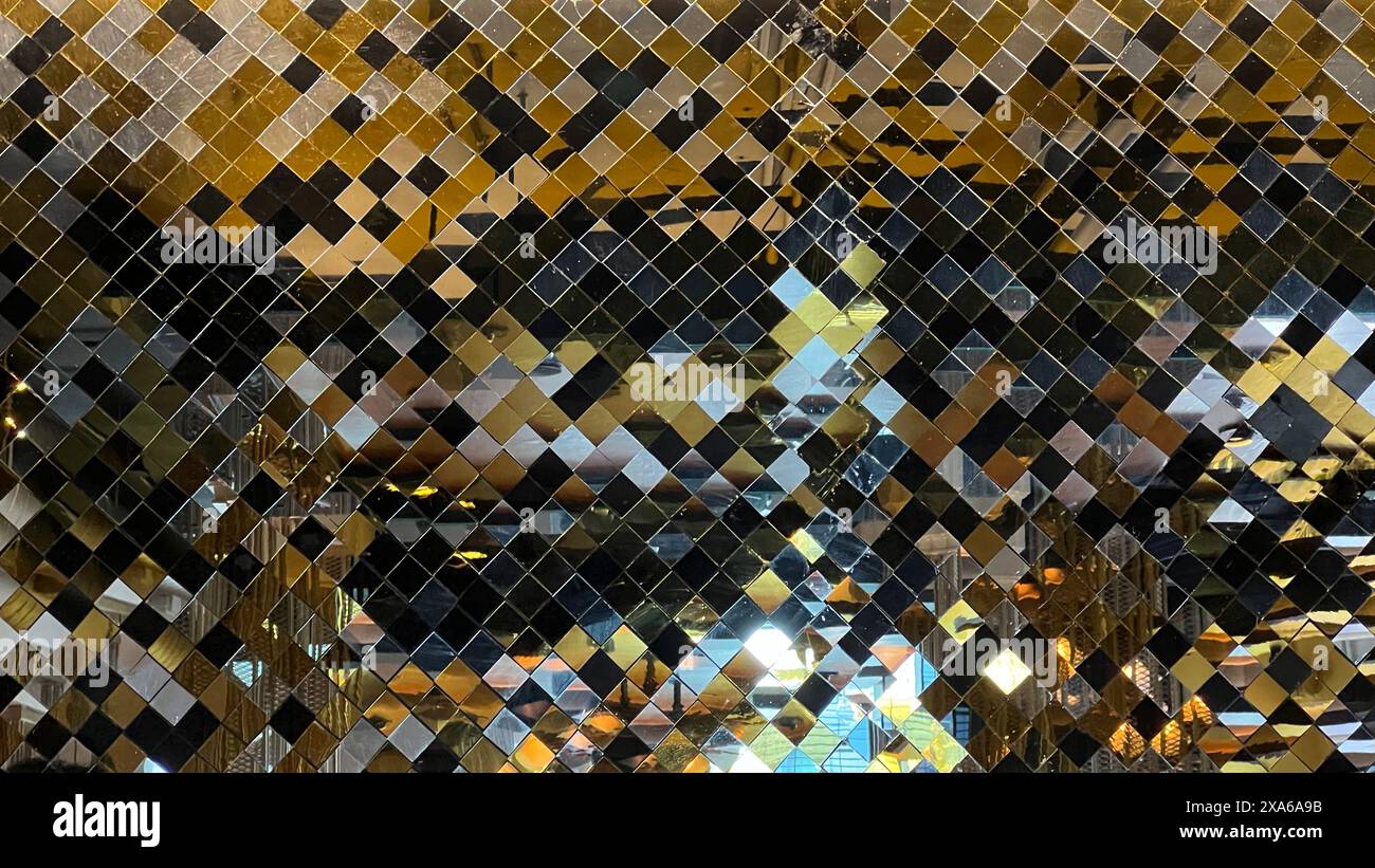 A shiny background of square mirrors on a wall Stock Photo - Alamy