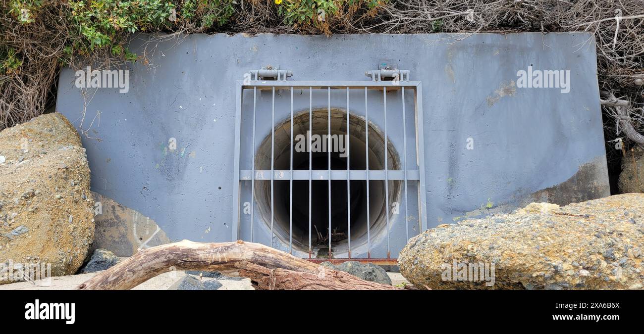 A wall grate with rocks on top Stock Photo - Alamy