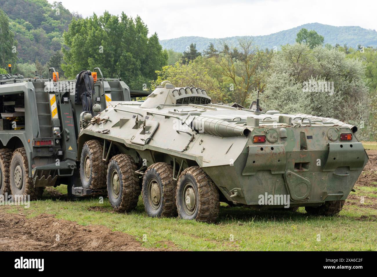 Russian BTR-80 armored personnel carrier in green camouflage attached to a tractor Stock Photo ...
