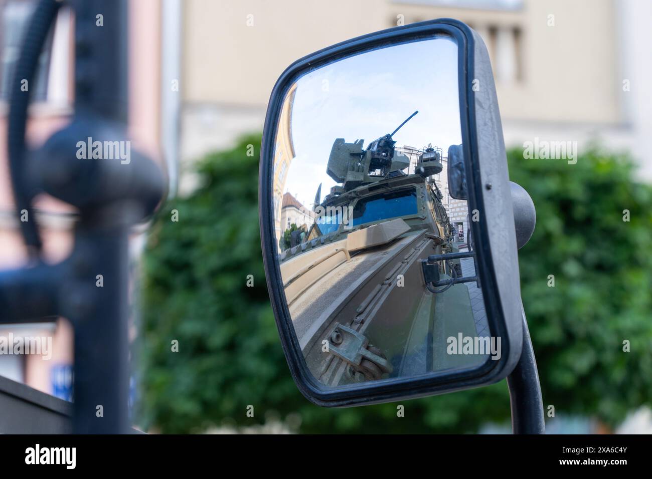 A camouflaged modern Gidran 4x4 MRAP armored fighting vehicle reflected ...