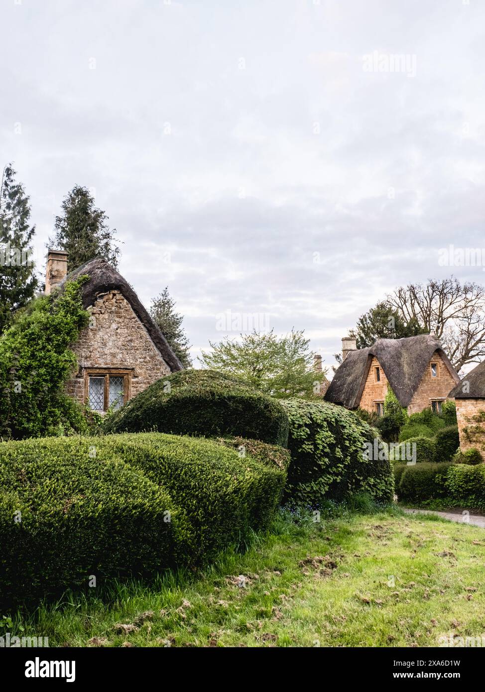 The Thatched cottages in the quintessential English Cotswold village of ...