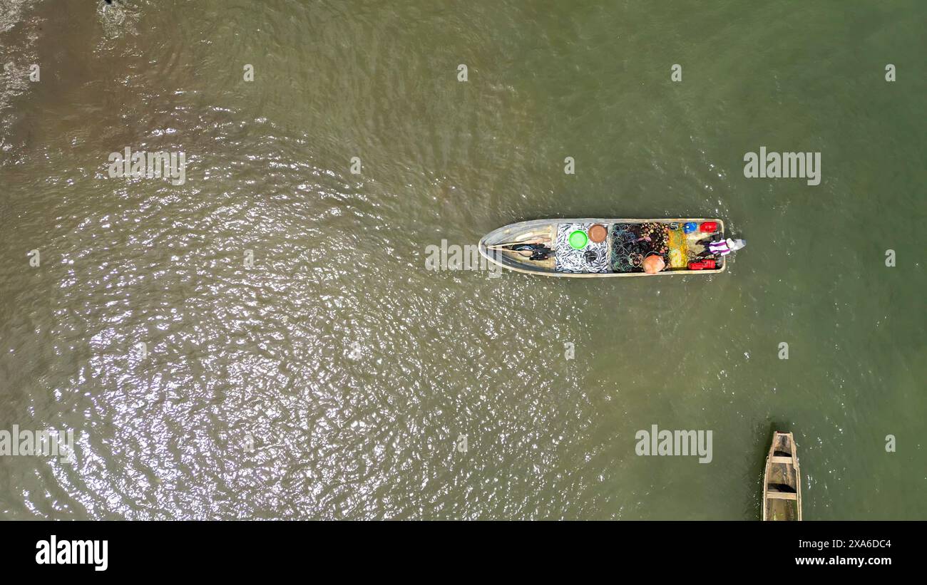 Two small boats and two smaller boats on the ocean Stock Photo - Alamy