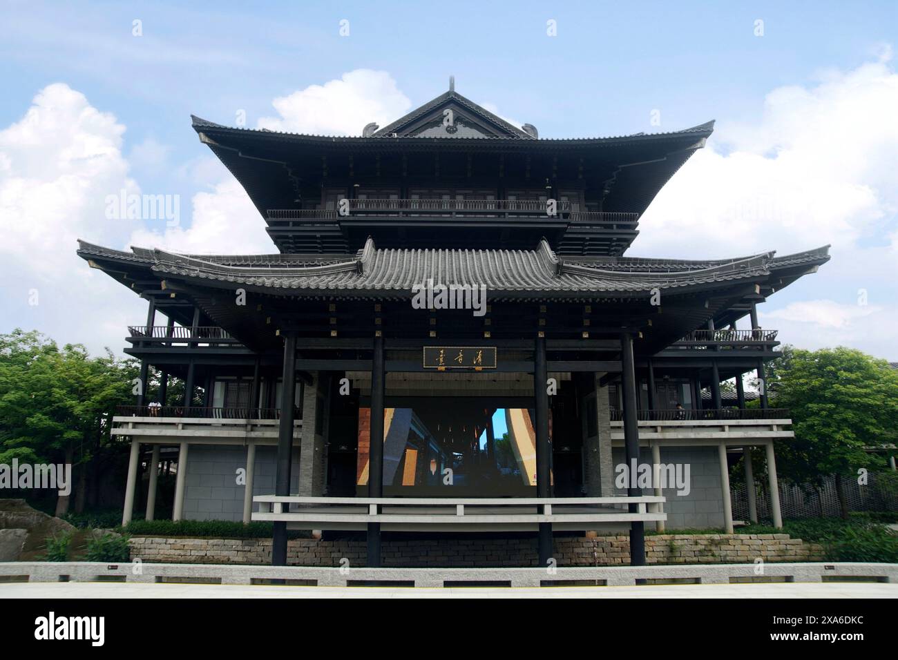 An Asian pagoda featuring large windows and columns on one side Stock ...