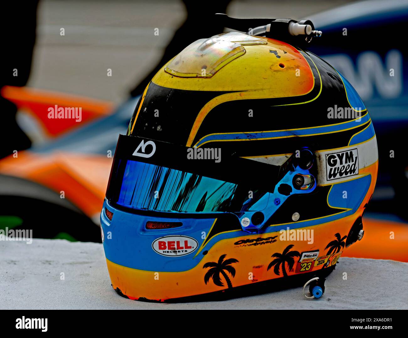 A racing helmet bright colorful bell indycar racing helmet with visor ...
