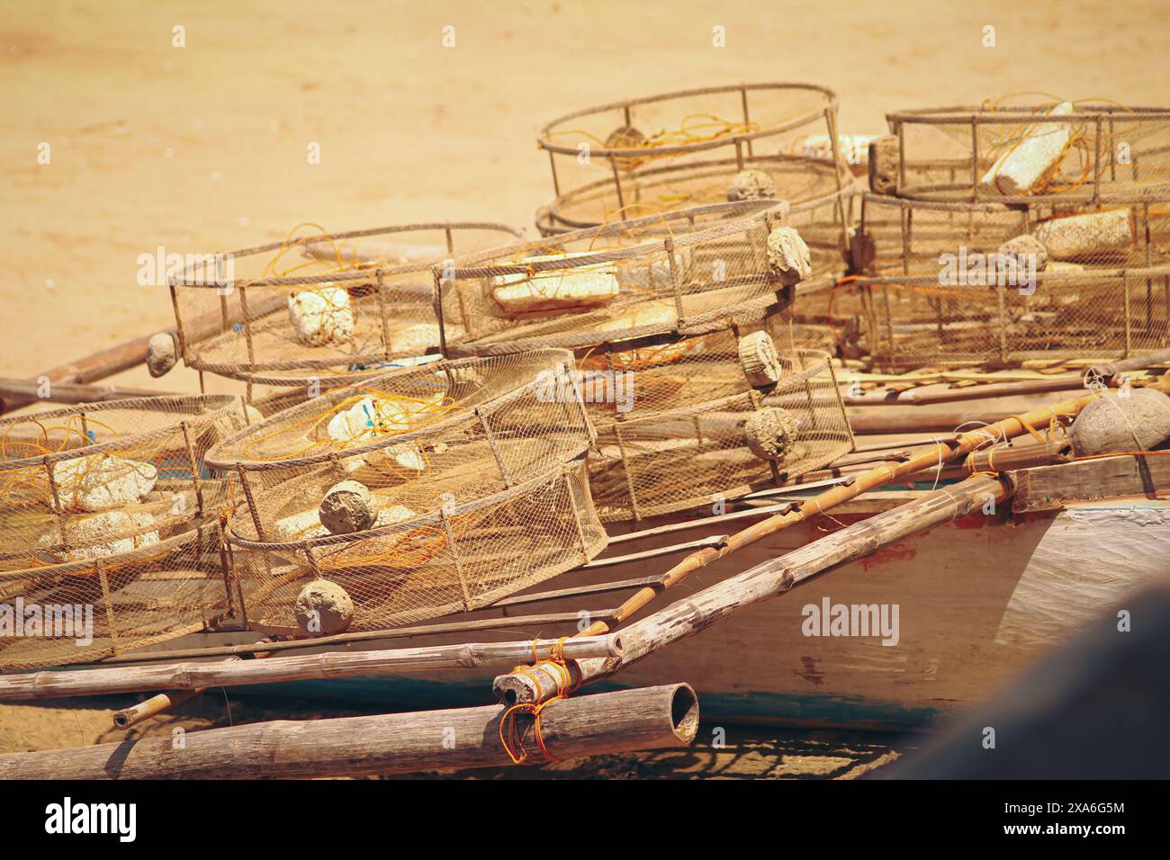 Traditional circular fish traps left to dry in the sun after being used ...