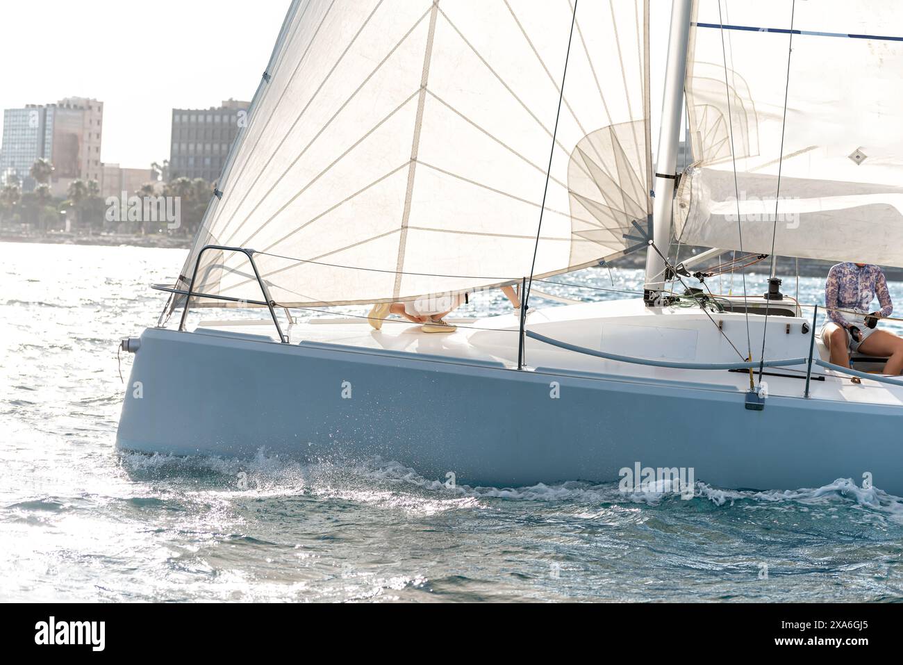 Sailboat competes in a regatta, reflecting teamwork and skill on ...