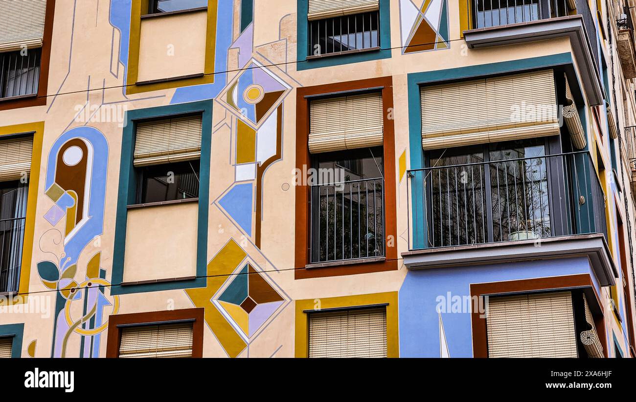 The Fun decals on apartment blocks in Barcelona, Spain Stock Photo - Alamy