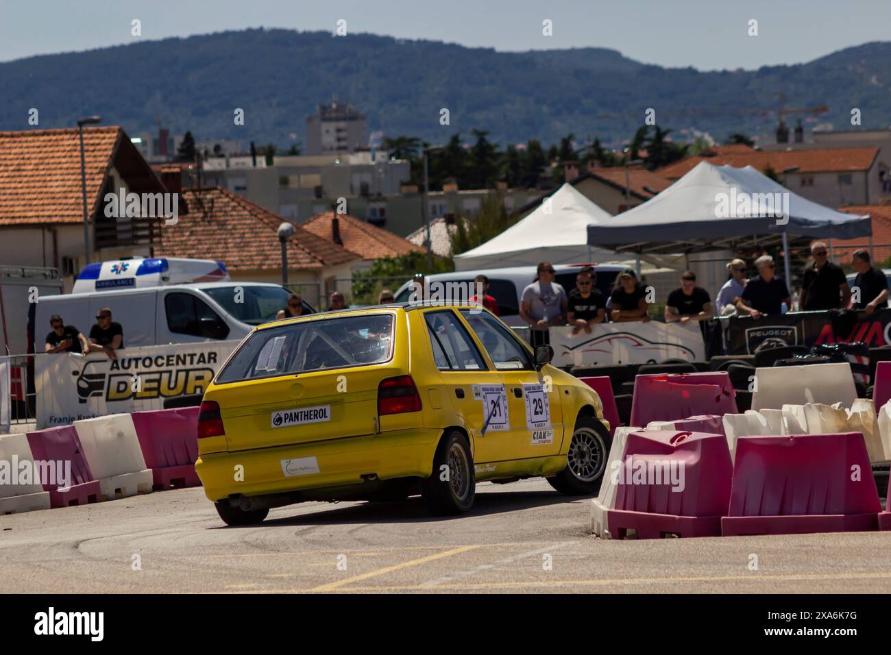 A yellow Skoda Felicia racing at a vintage car exhibit in Zadar ...