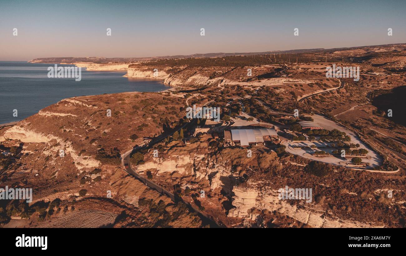 Aerial view of sunset over farm and dirt hills inKourion Amphitheater ...