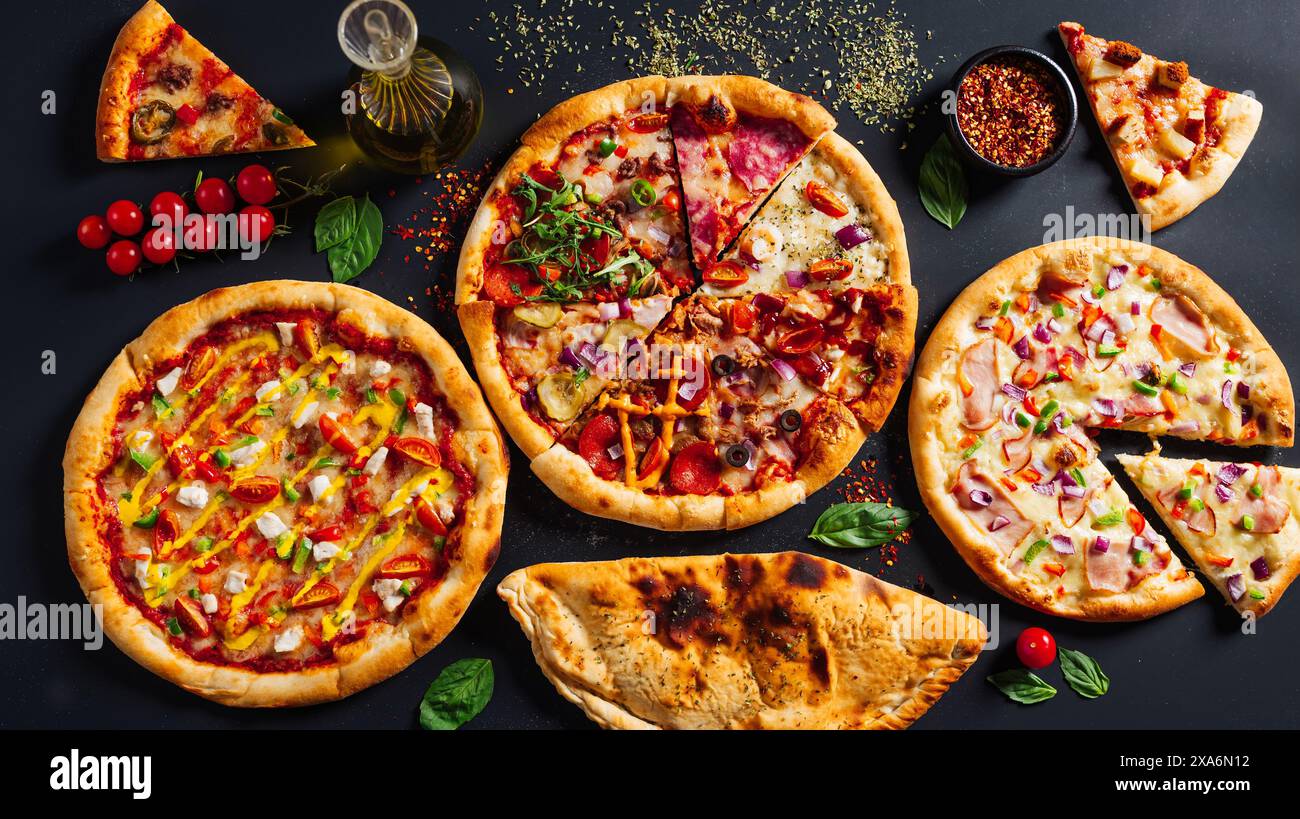 Four pizzas, three pepperoni, and one chicken, displayed on a black ...