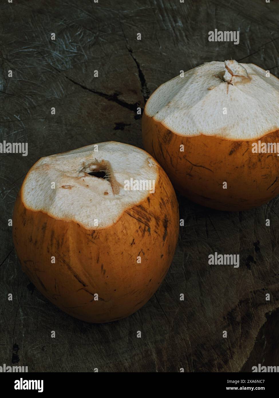 Two fresh coconuts prepared for a drink Stock Photo - Alamy
