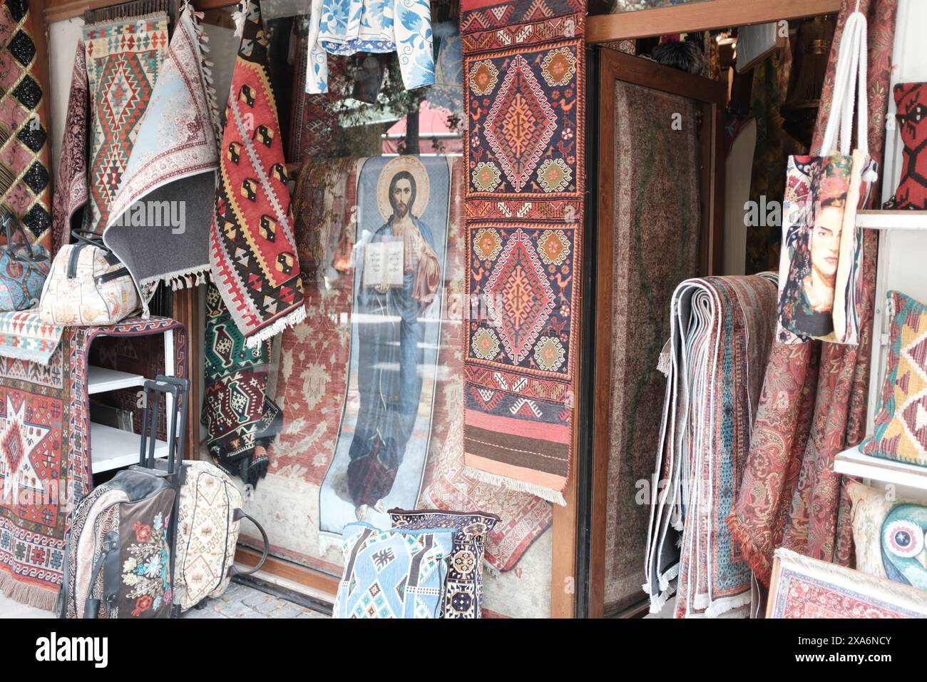 The colorful rugs adorn a building facade in Selcuk, Turkey Stock Photo ...