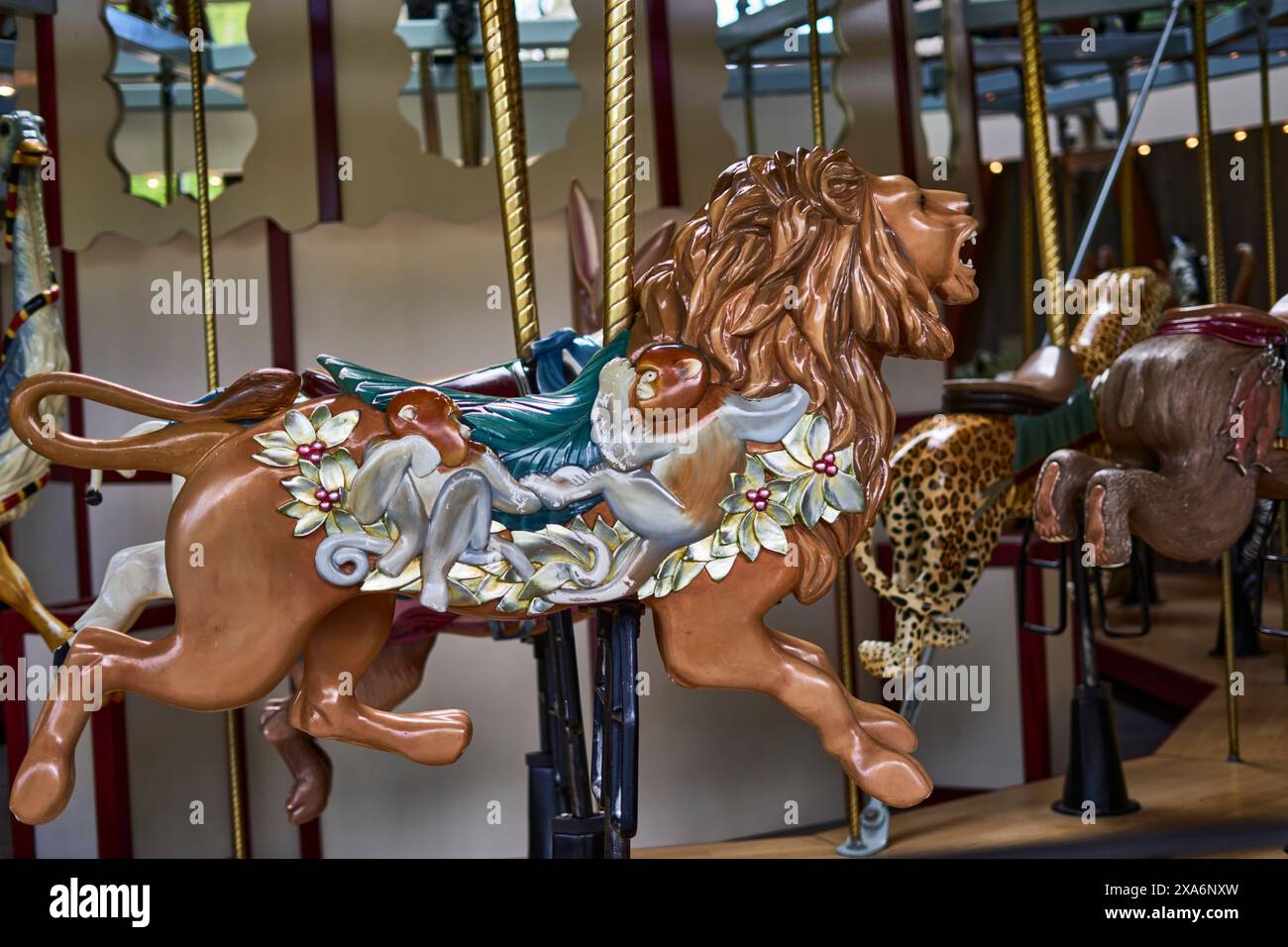 A wonderful decorated lion to ride on at the rose carousel at Butchart ...
