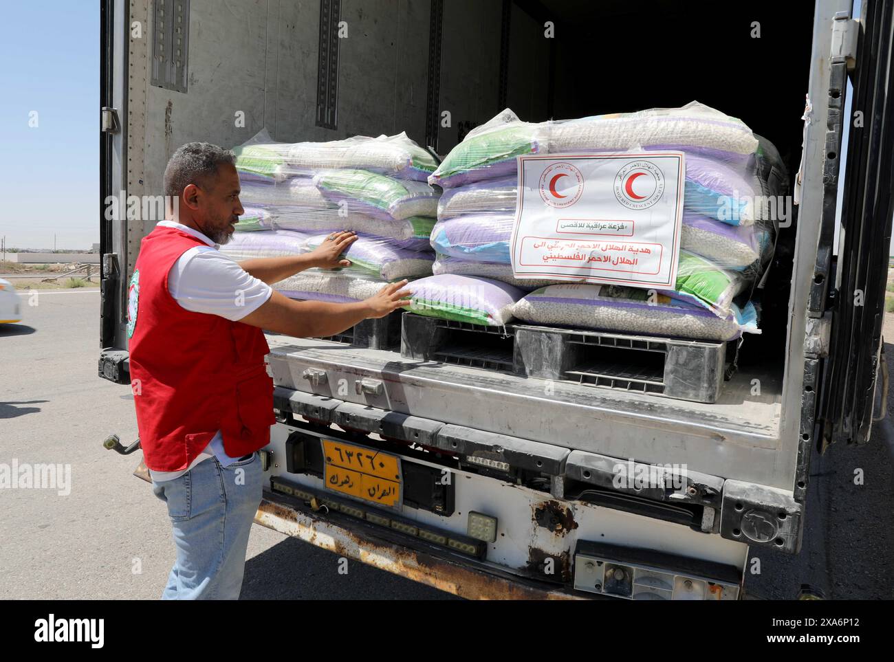 Ramadi, Iraq. 4th June, 2024. A staff member of the Iraqi Red Crescent ...