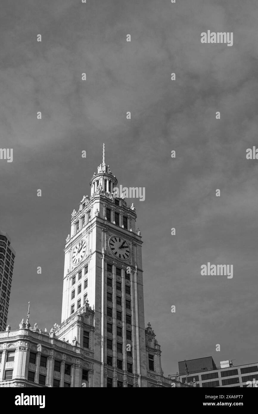 A city skyline with a prominent clock tower under a cloudy sky in ...