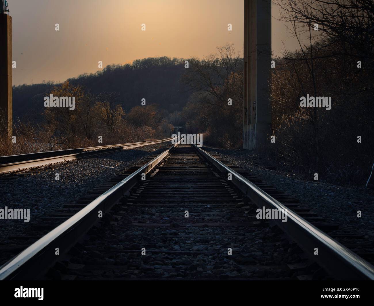 The railway track on ground at sunset Stock Photo - Alamy