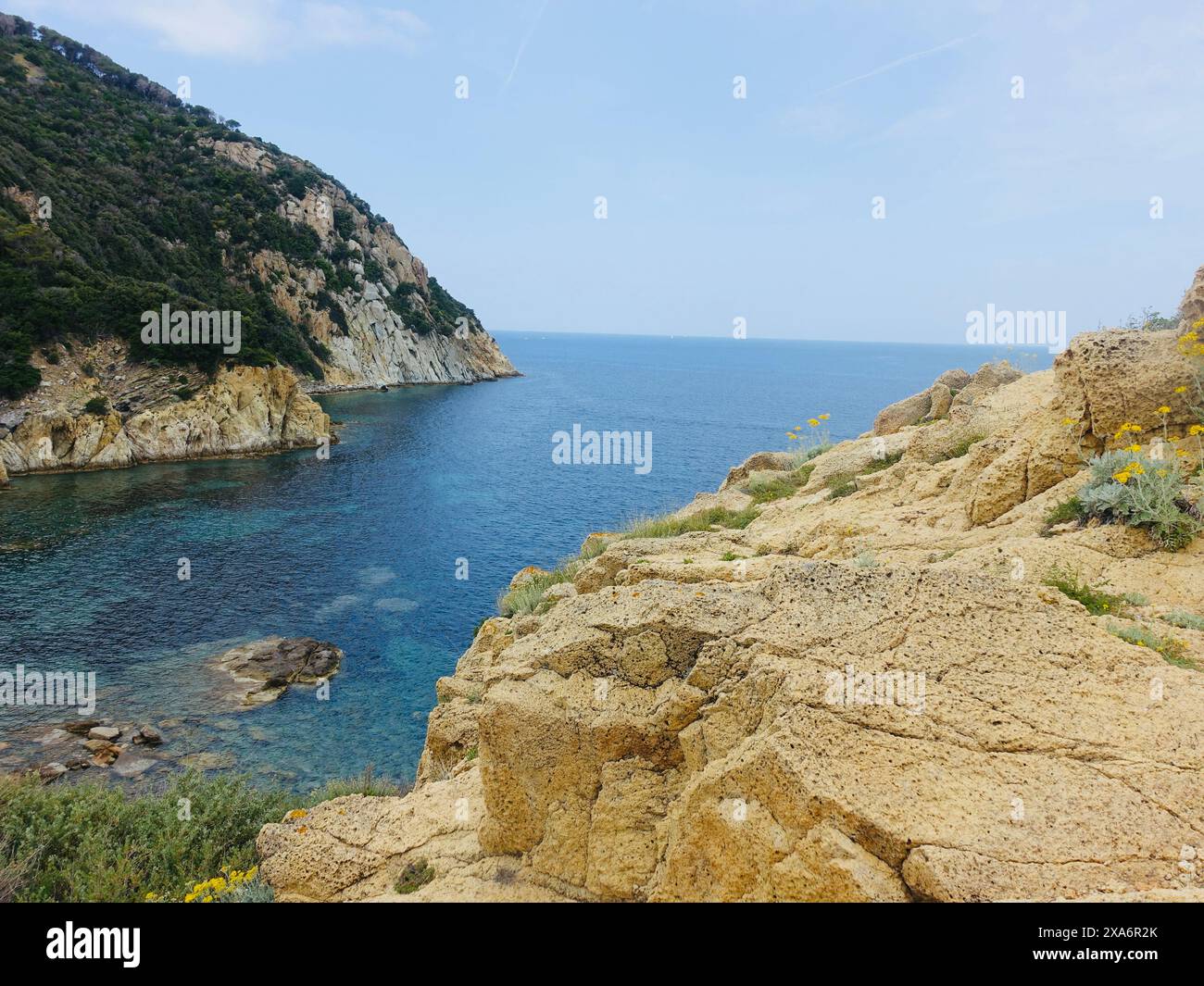 A scenic lake nestled amidst rocky mountains and cliffs Stock Photo - Alamy
