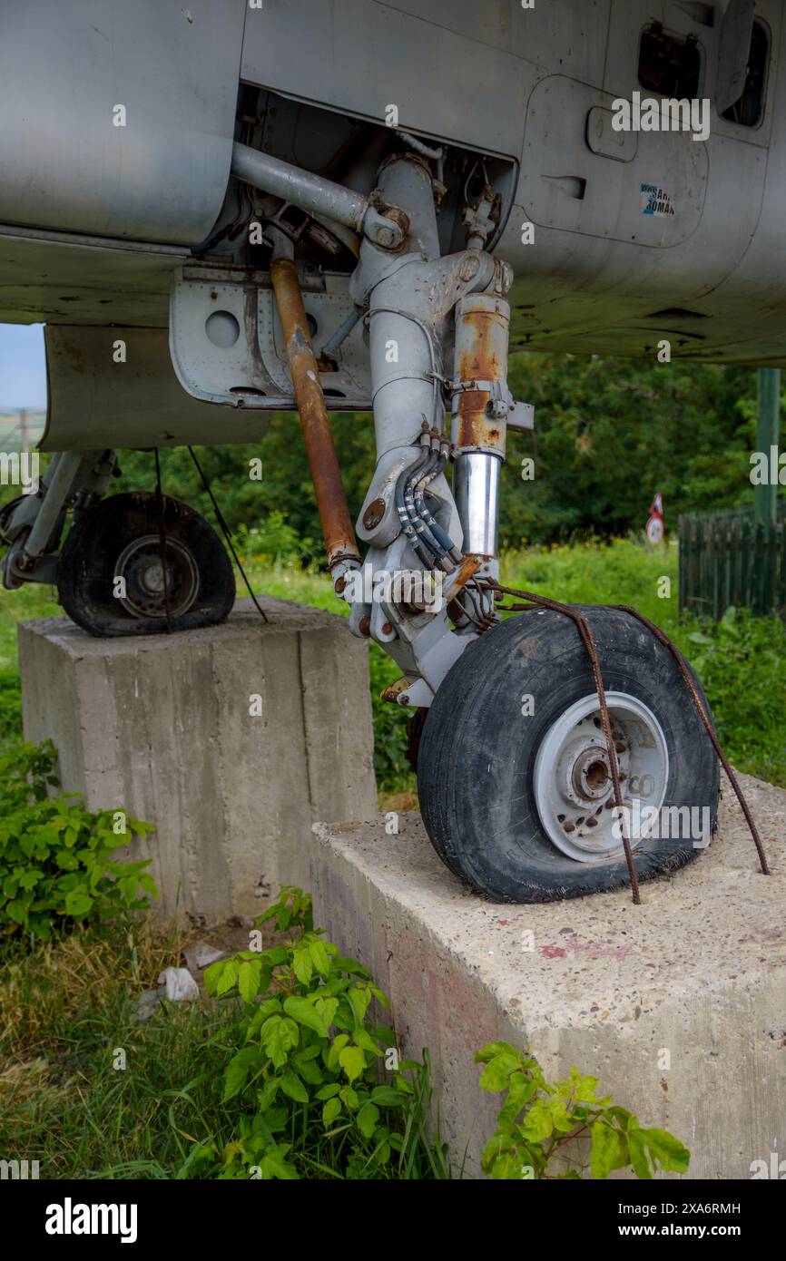 A vintage airplane wheel and tire on a pedestal Stock Photo - Alamy