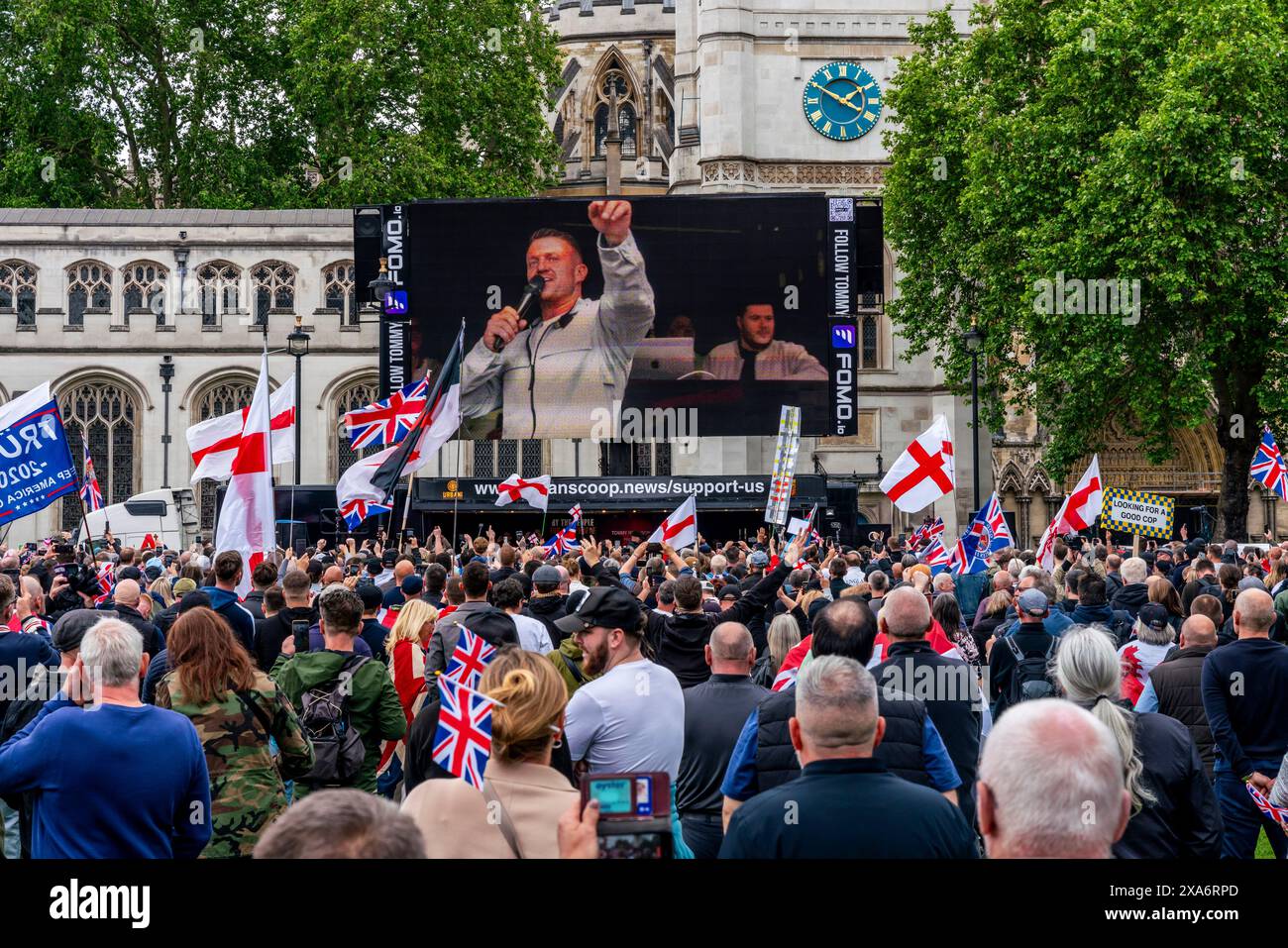Political Activist Tommy Robinson seen on the big screen giving a ...