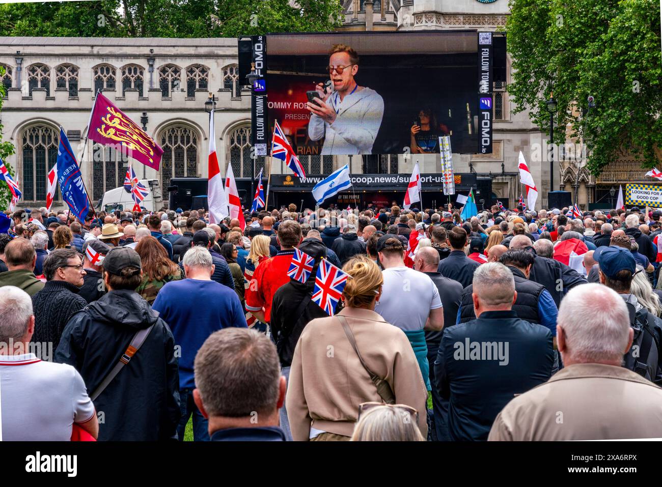 Political Activist Laurence Fox seen on the big screen giving a speech ...