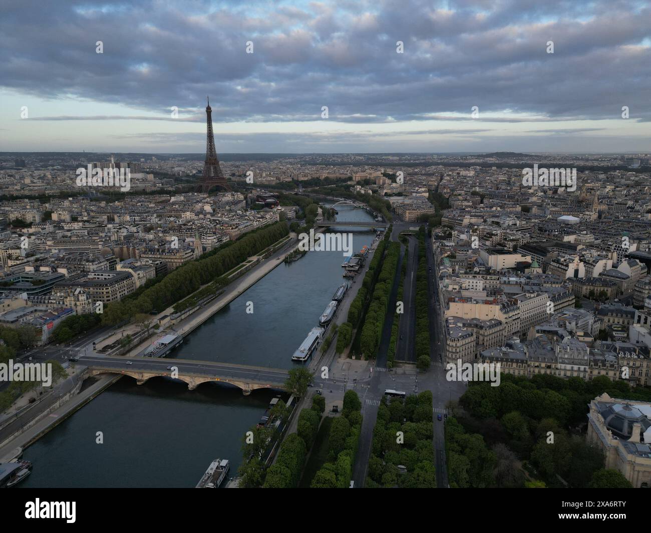 An aerial view of Eiffel Tower at sunrise, along with views of the ...