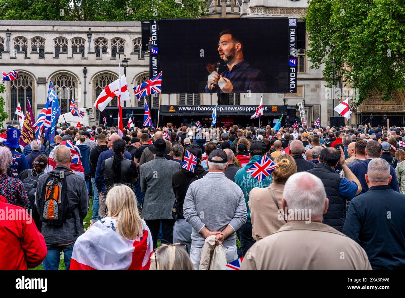 You Tuber Carl Benjamin seen on the big screen giving a speech after a ...