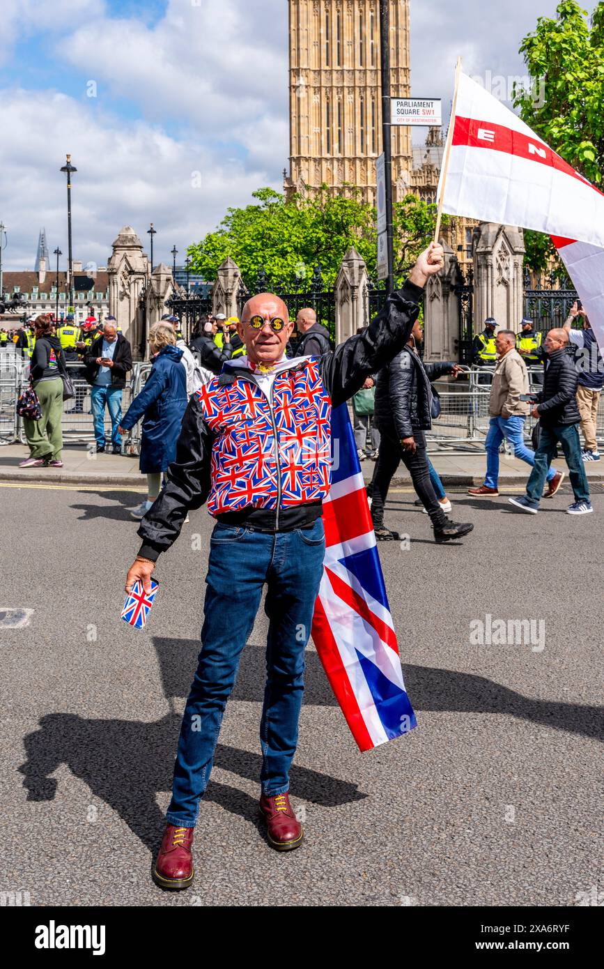 A Man Wearing a Union Jack Costume Waves An English Cross of St George ...