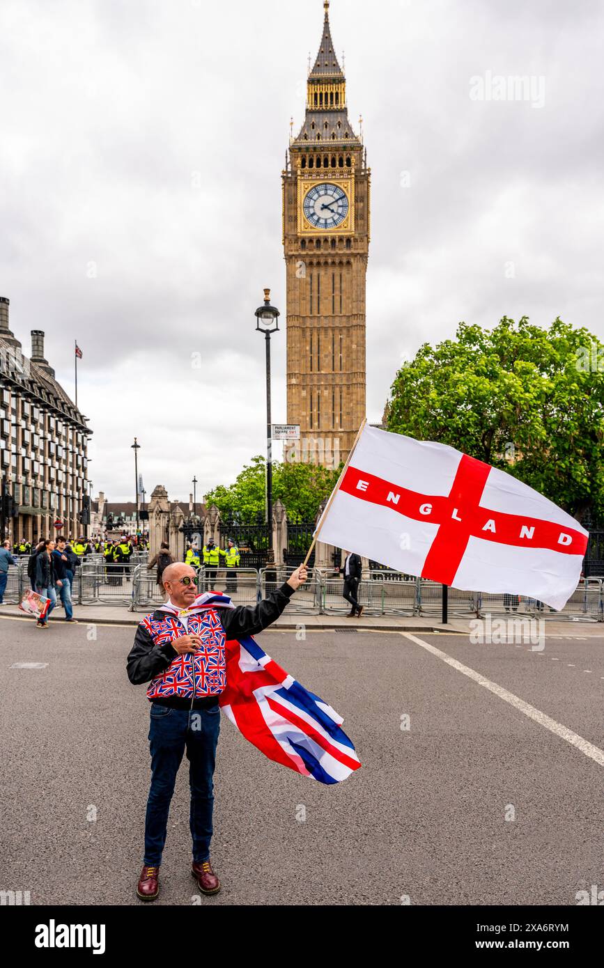 A Man Wearing a Union Jack Costume Waves An English Cross of St George ...