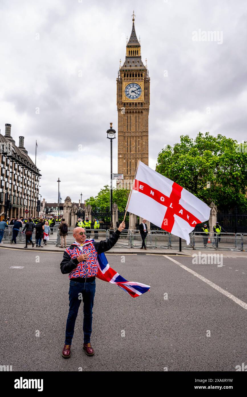 A Man Wearing a Union Jack Costume Waves An English Cross of St George ...