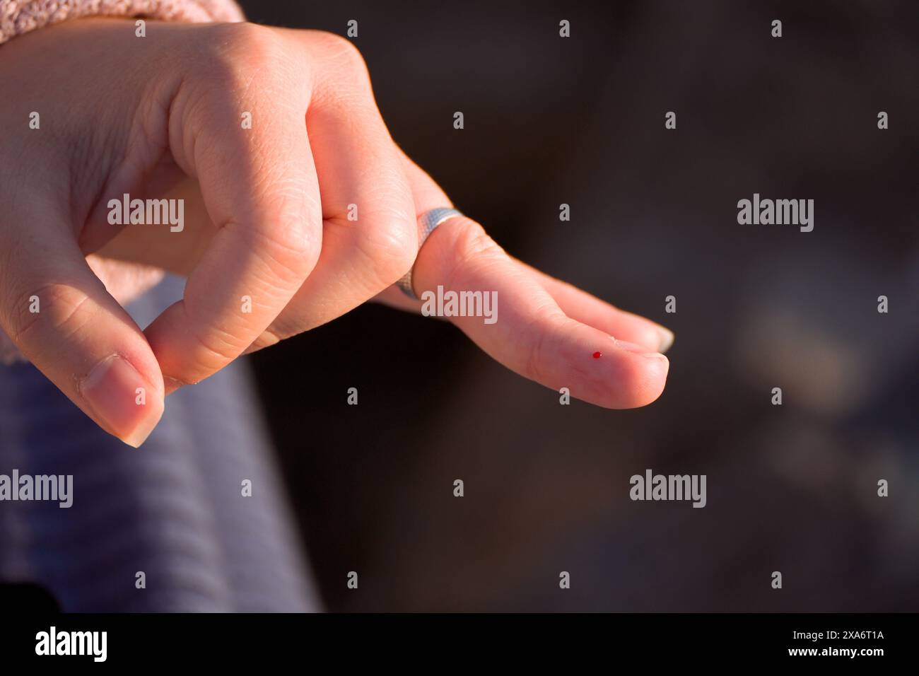 A person gesturing and pointing with both hands raised Stock Photo - Alamy