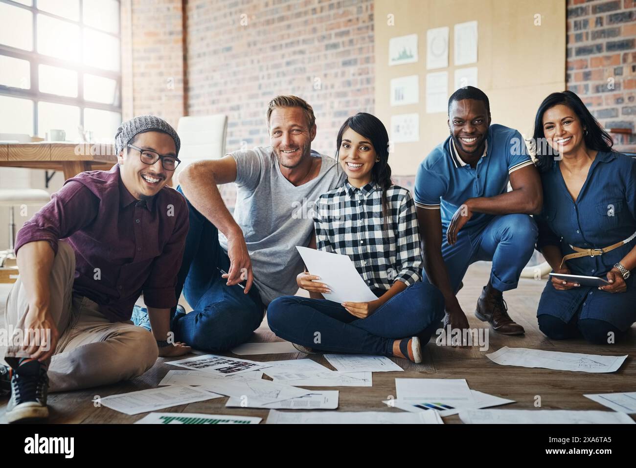 People, creative and portrait in office with paperwork or documents for ...