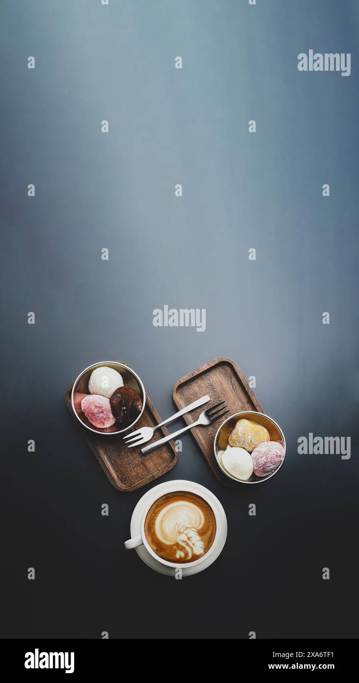Top-down view of mochi with coffee on gray backdrop Stock Photo - Alamy