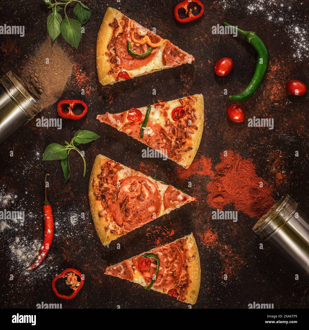 A top view of slices of pizza on a counter with spices Stock Photo - Alamy