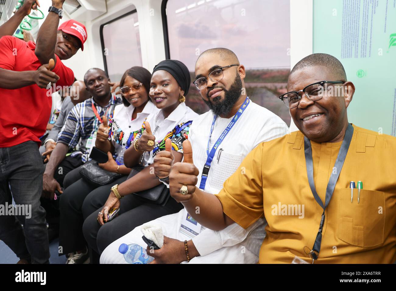 Abuja, Nigeria. 29th May, 2024. Staff members of the Abuja metro rail operation pose for a group ...