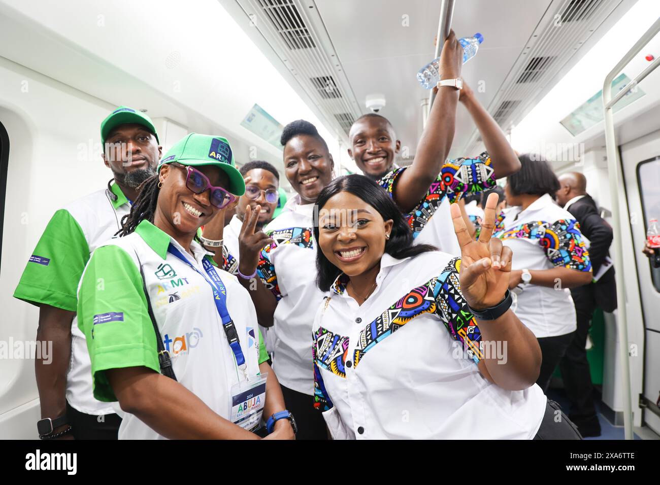 Abuja, Nigeria. 29th May, 2024. Staff members of the Abuja metro rail operation pose for a group ...
