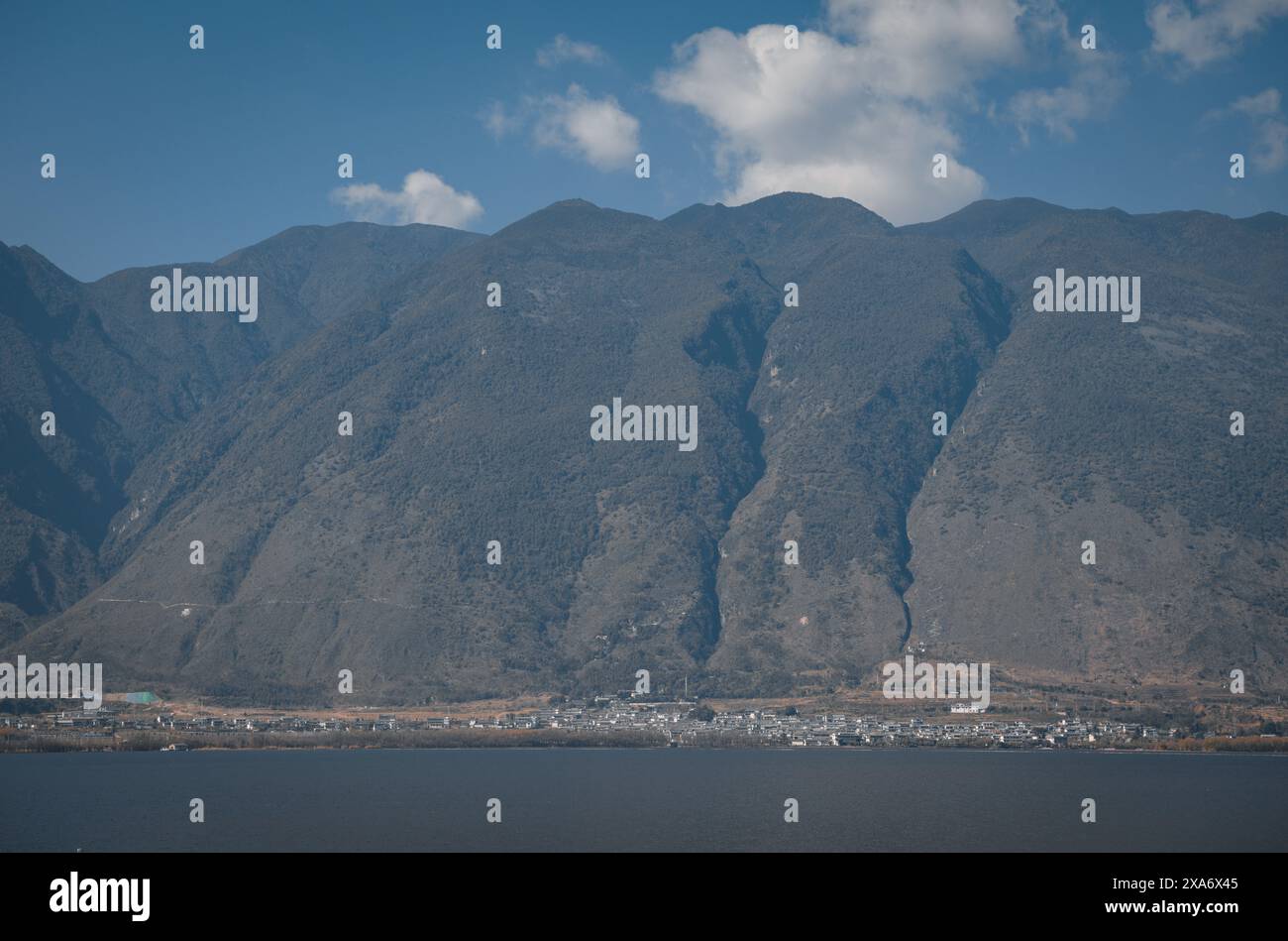 A scenic mountain backdrop against vast water body Stock Photo - Alamy