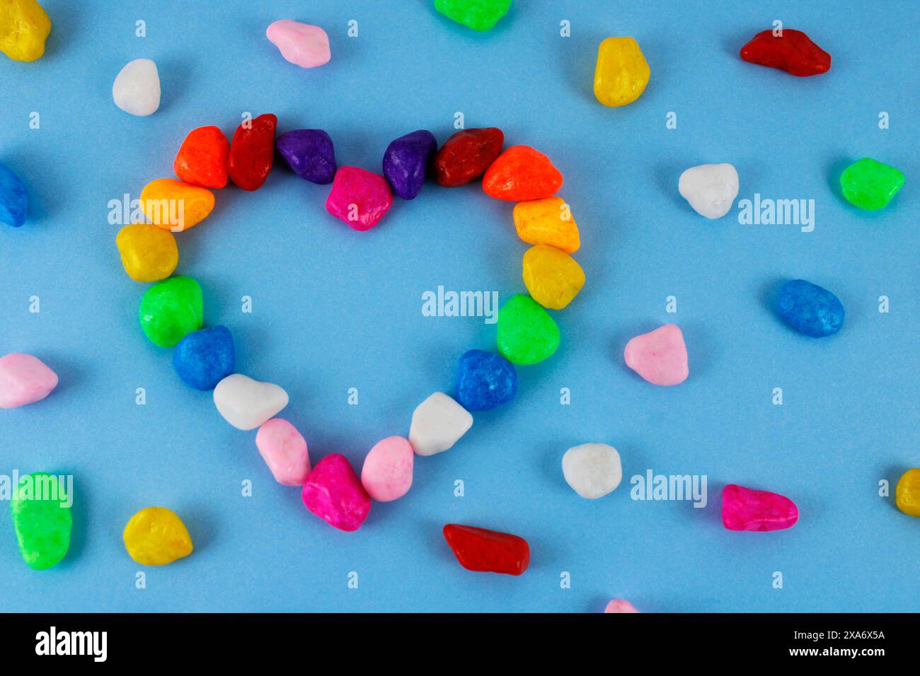 Heart formed with stones that have the colors of the rainbow Stock ...