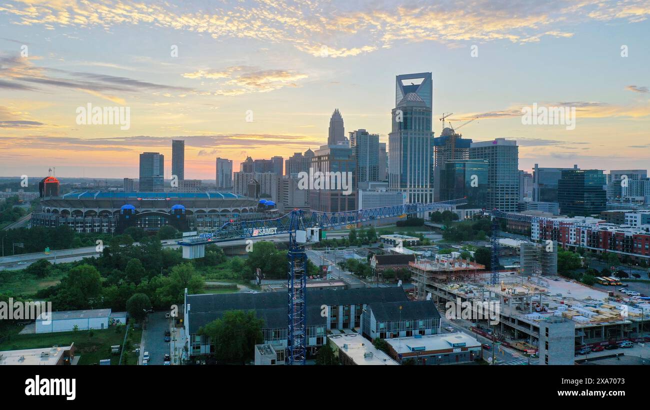 A city skyline with tall buildings against evening sky Stock Photo - Alamy