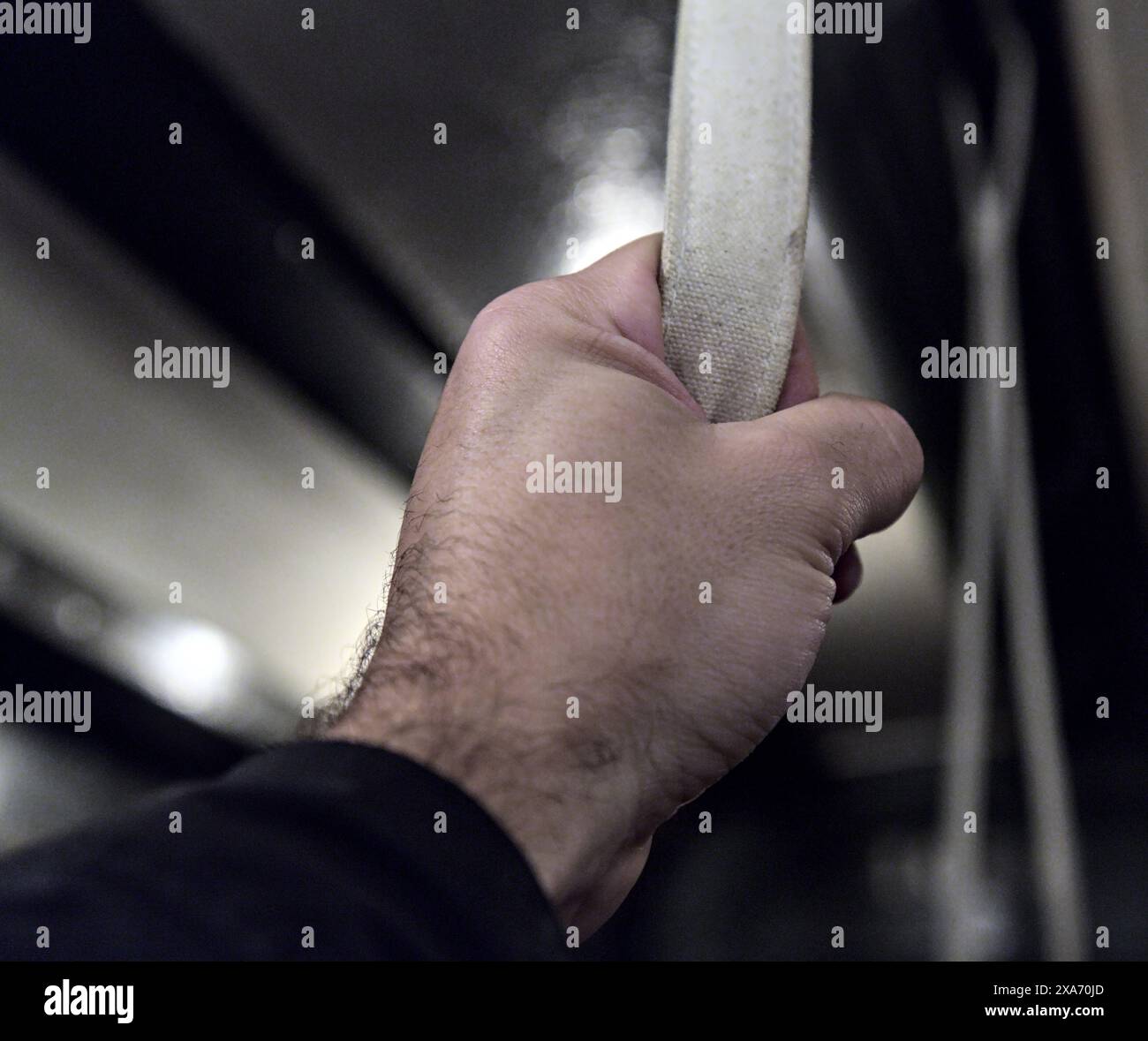 hand holding a strap on a subway car close up (vintage old time ...
