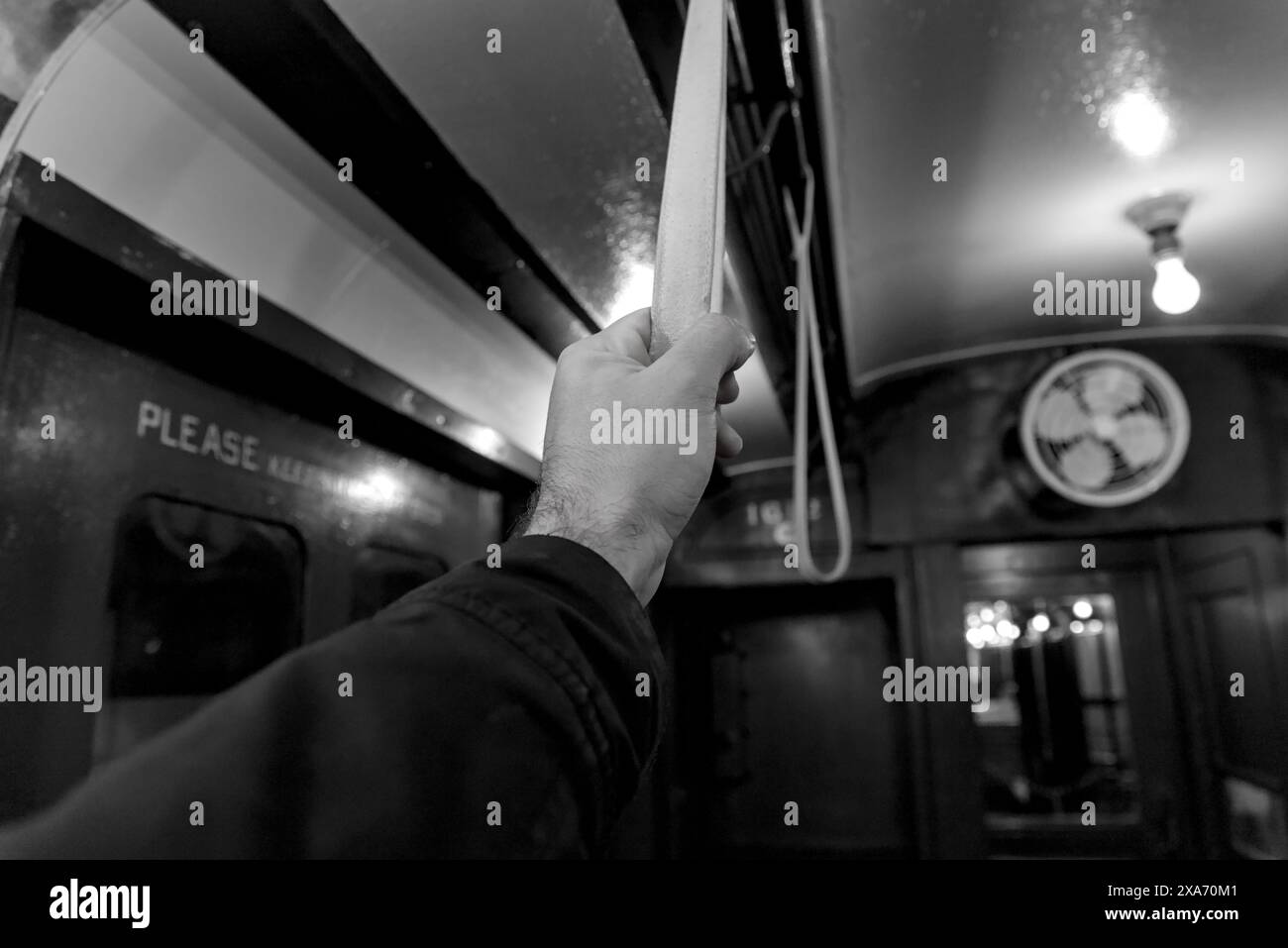 hand holding a strap on a subway car close up (vintage old time ...