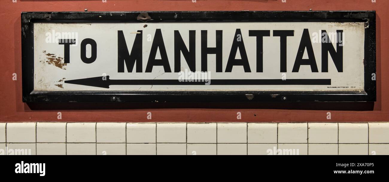 to manhattan subway sign with arrow (old fashioned, antique, vintage ...