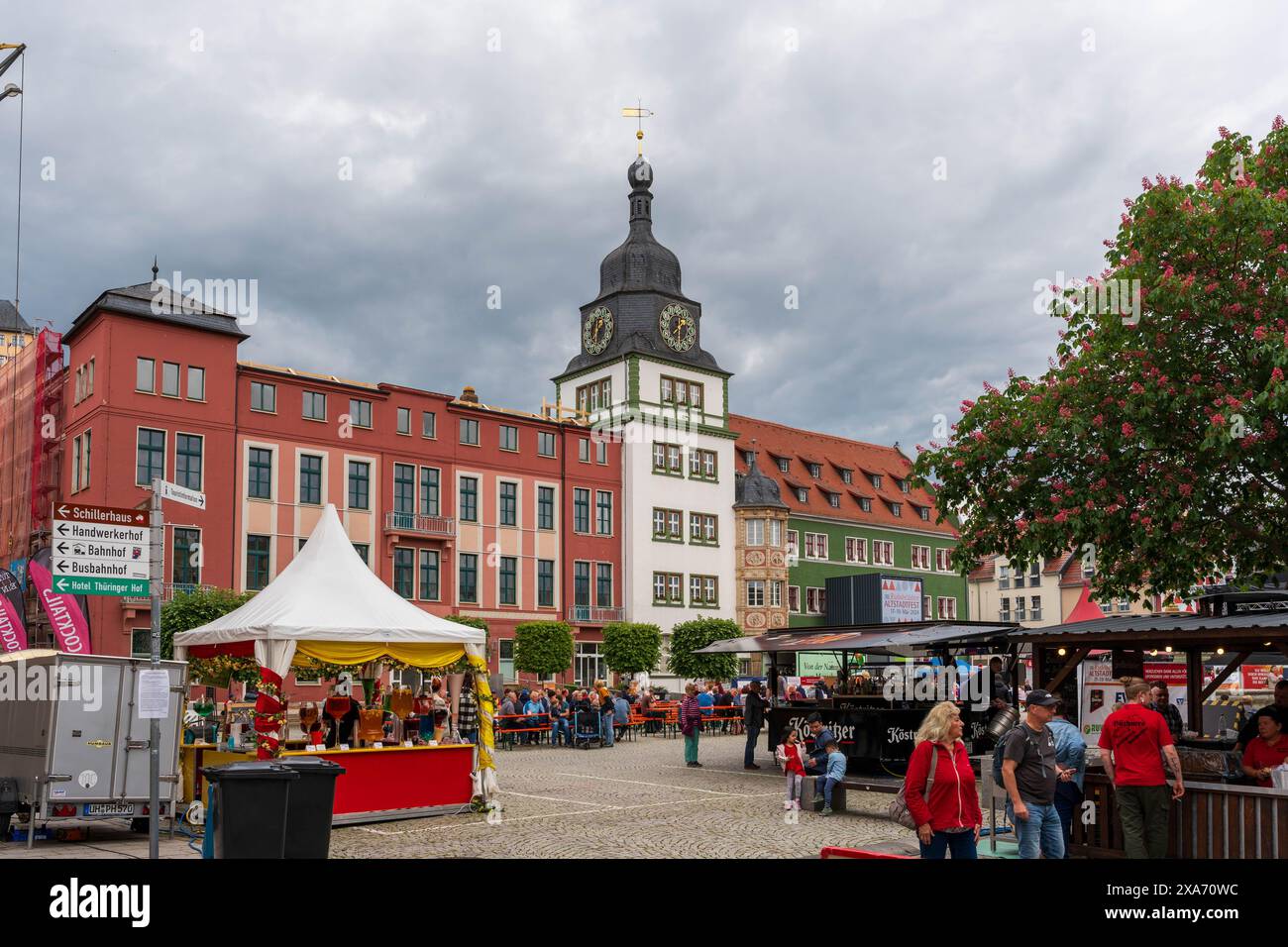 A crowd gathered around a building in urban square Stock Photo - Alamy